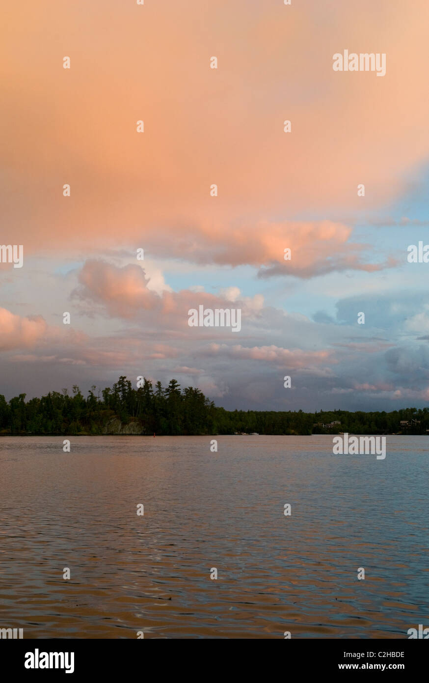 Lake Of The Woods, Ontario, Canada; Sunset Turning Cloud Orange Over ...