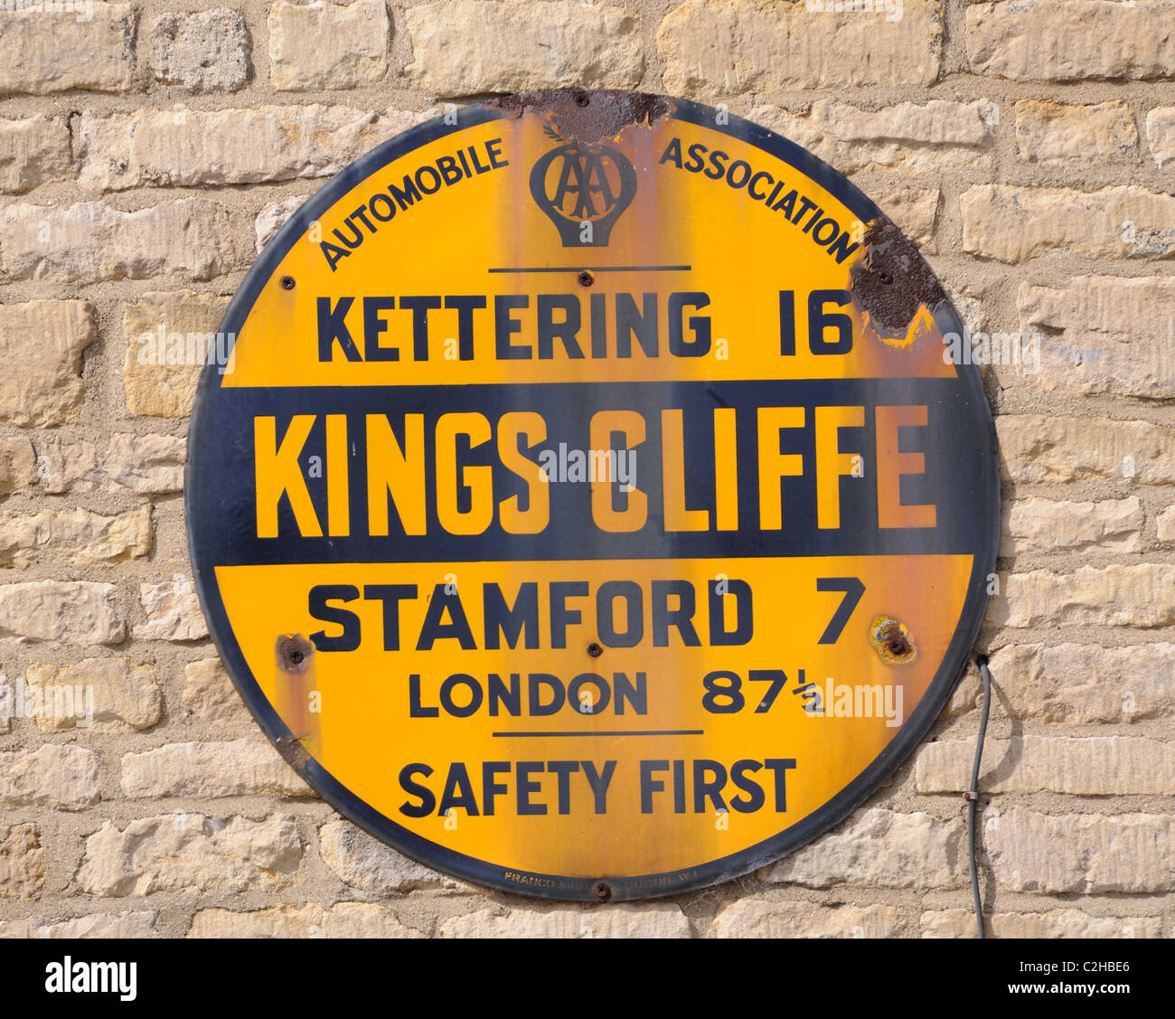 Vintage AA road sign on the wall of a former public house in King's ...