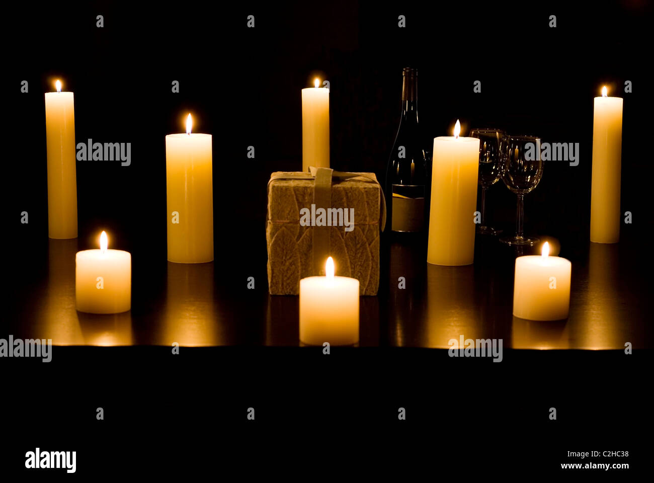 Group Of Lit Candles On A Table Stock Photo - Alamy