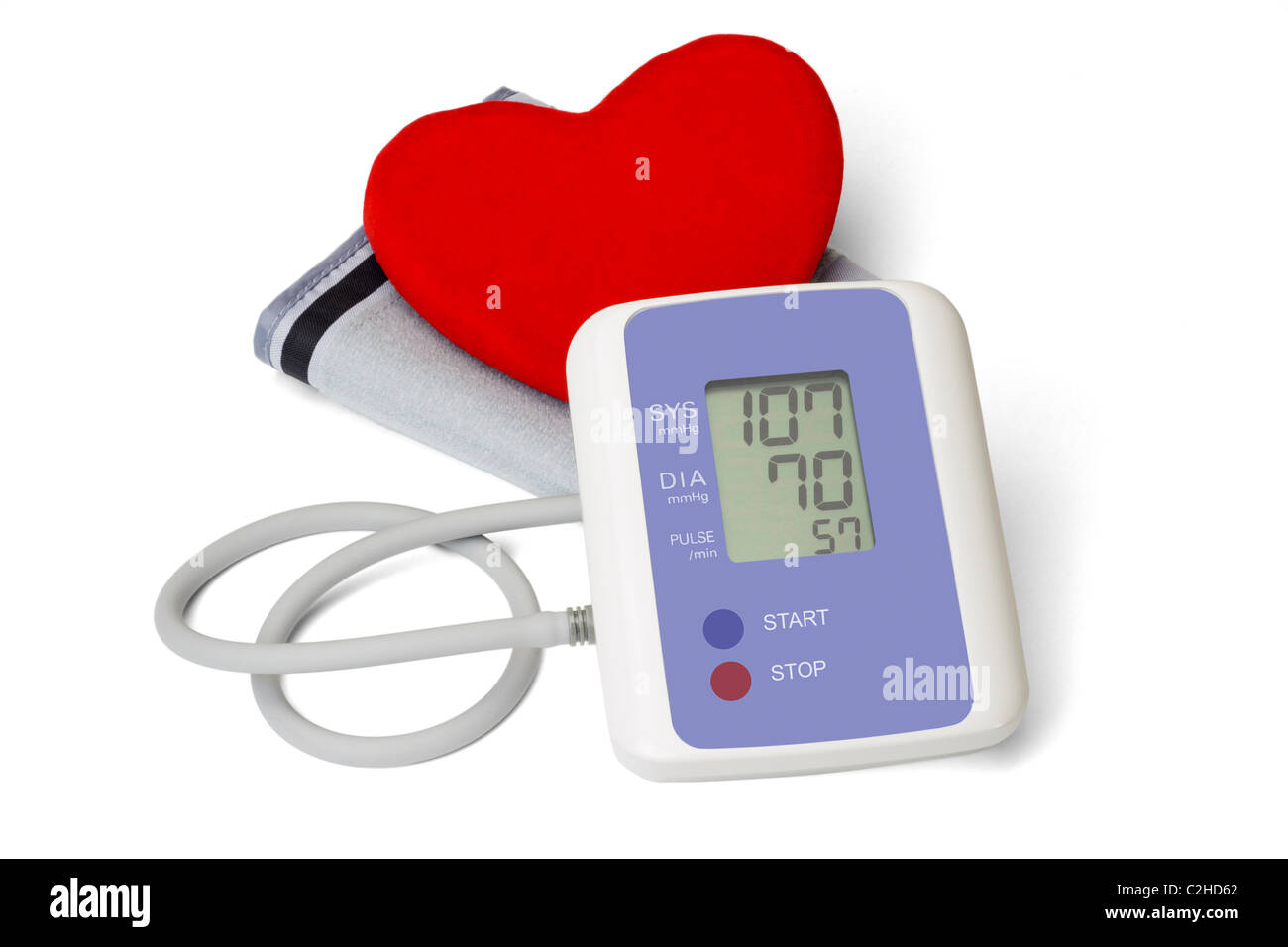 Digital blood pressure meter with love heart symbol on white background ...