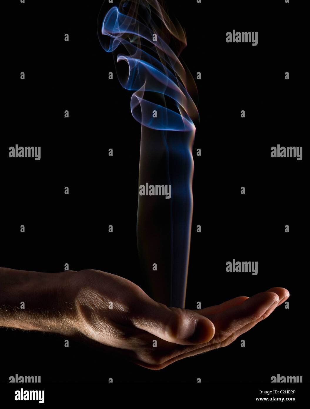 Smoke Rising From A Hand Stock Photo - Alamy