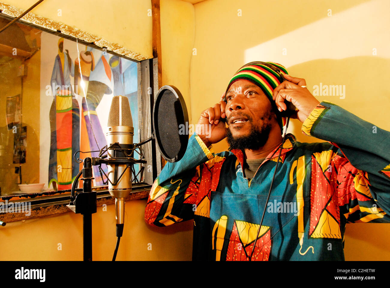 Reggae musician "Sugar B" recording vocals in the vocal booth at Lazeme ...
