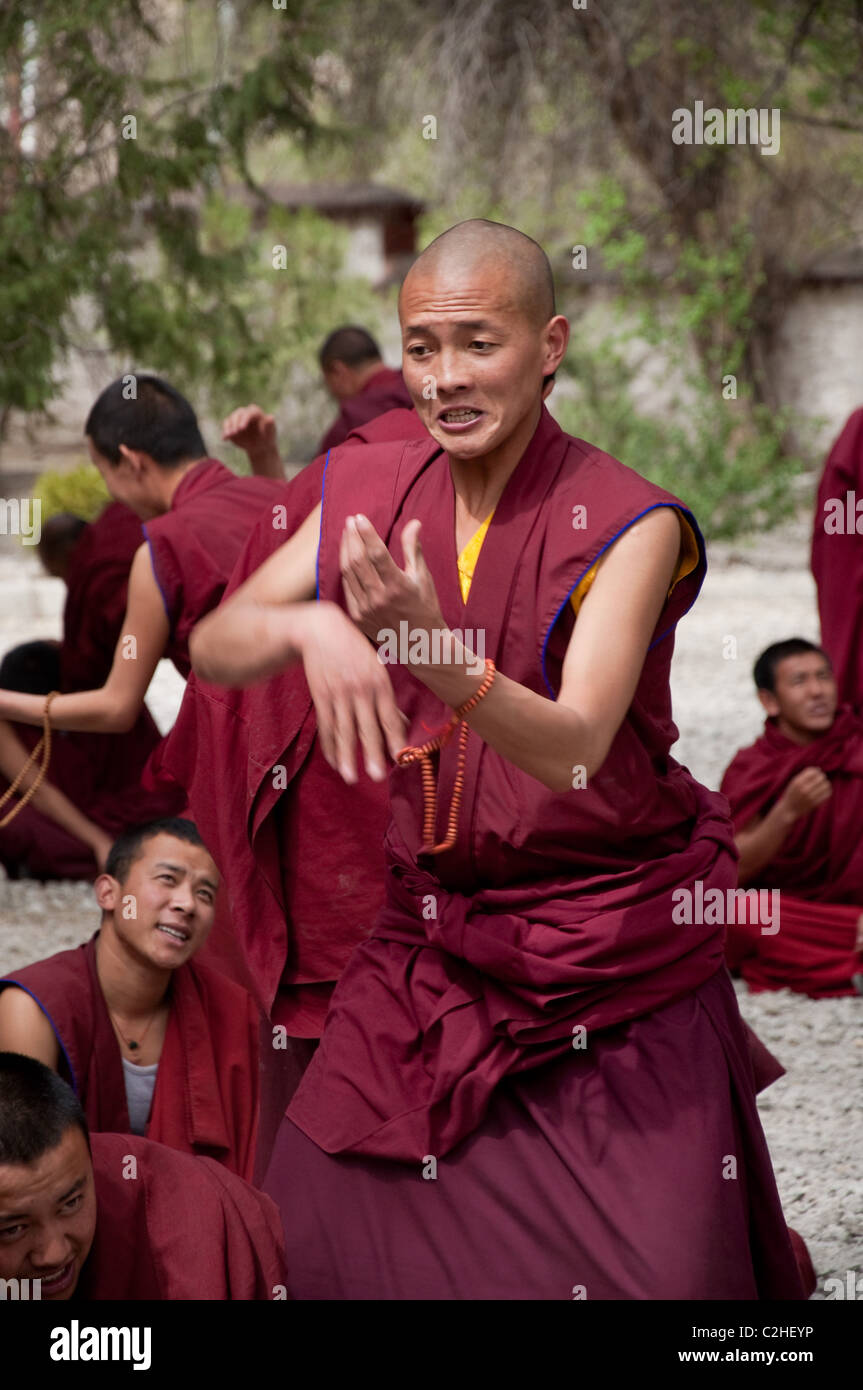 Buddhist monks in heated debate Stock Photo - Alamy