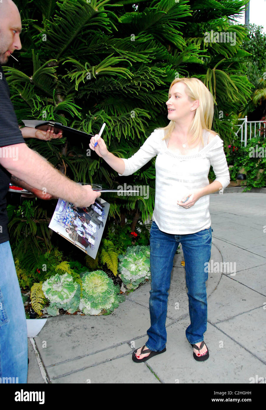 Angela Kinsey NBC's 'The Office' star signs autographs as she heads to ...