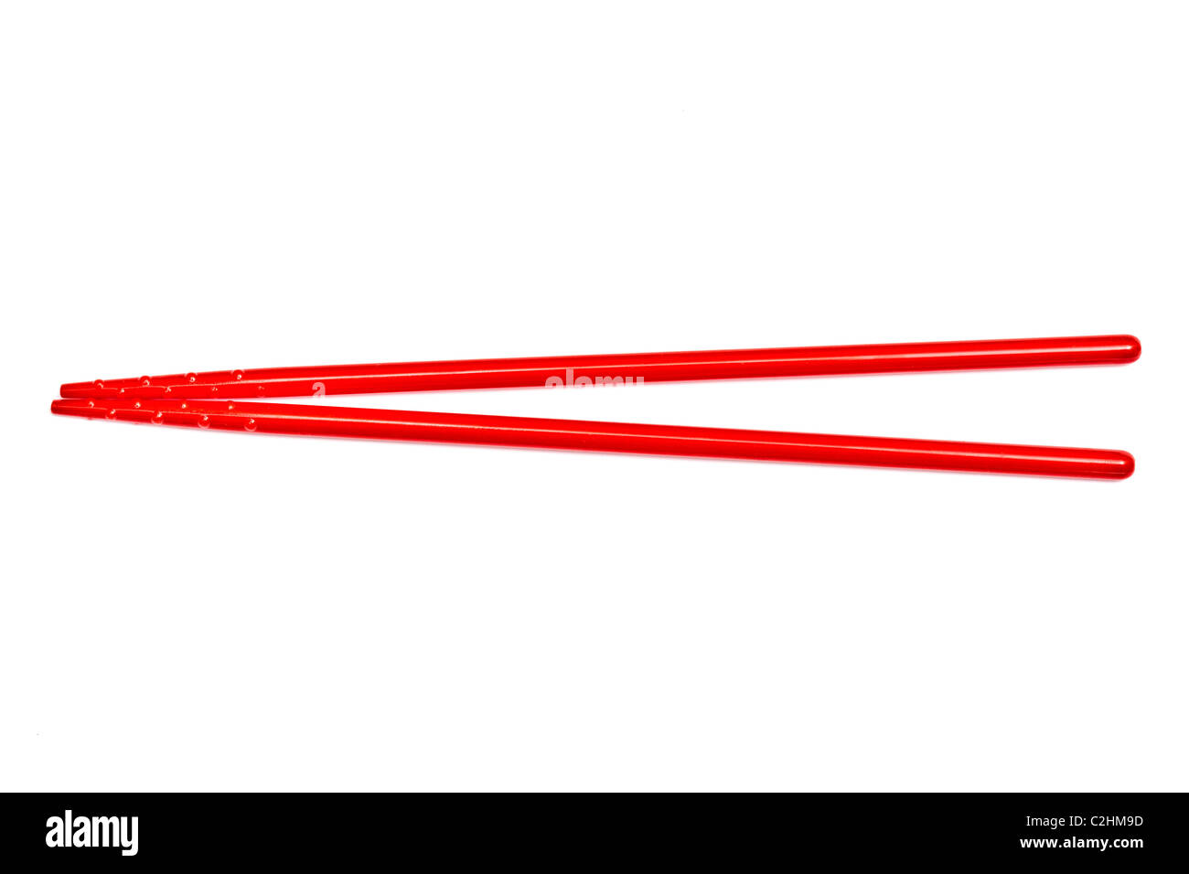 Red chopsticks isolated on white background Stock Photo - Alamy
