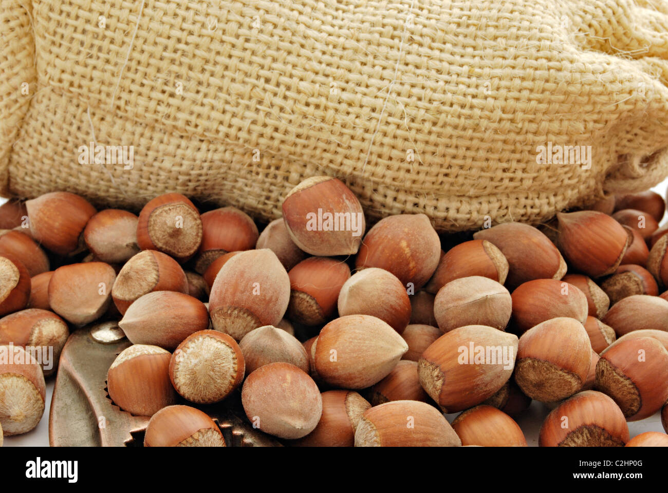 nutcracker and heap of hazelnuts Stock Photo - Alamy