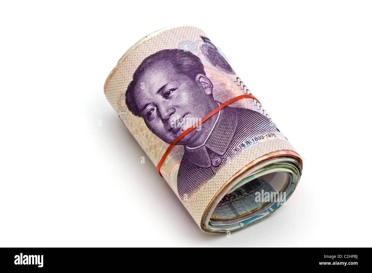 Roll of chinese money closeup on white background Stock Photo - Alamy