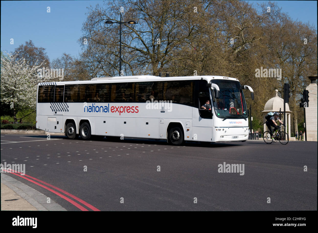 A three axle National Express coach rounds Hyde park Corner on its way ...