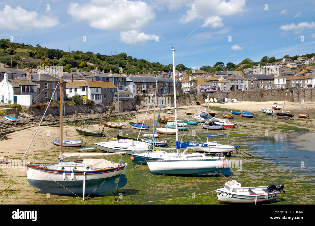 The harbour at low tide at Mousehole in Cornwall, England, UK Stock ...