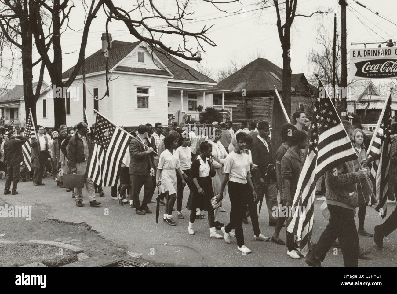 Participants, some carrying American flags, marching in the civil ...