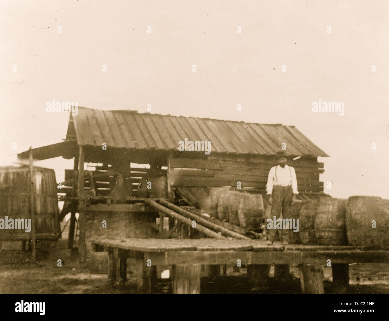 Man unloading barrels hi-res stock photography and images - Alamy