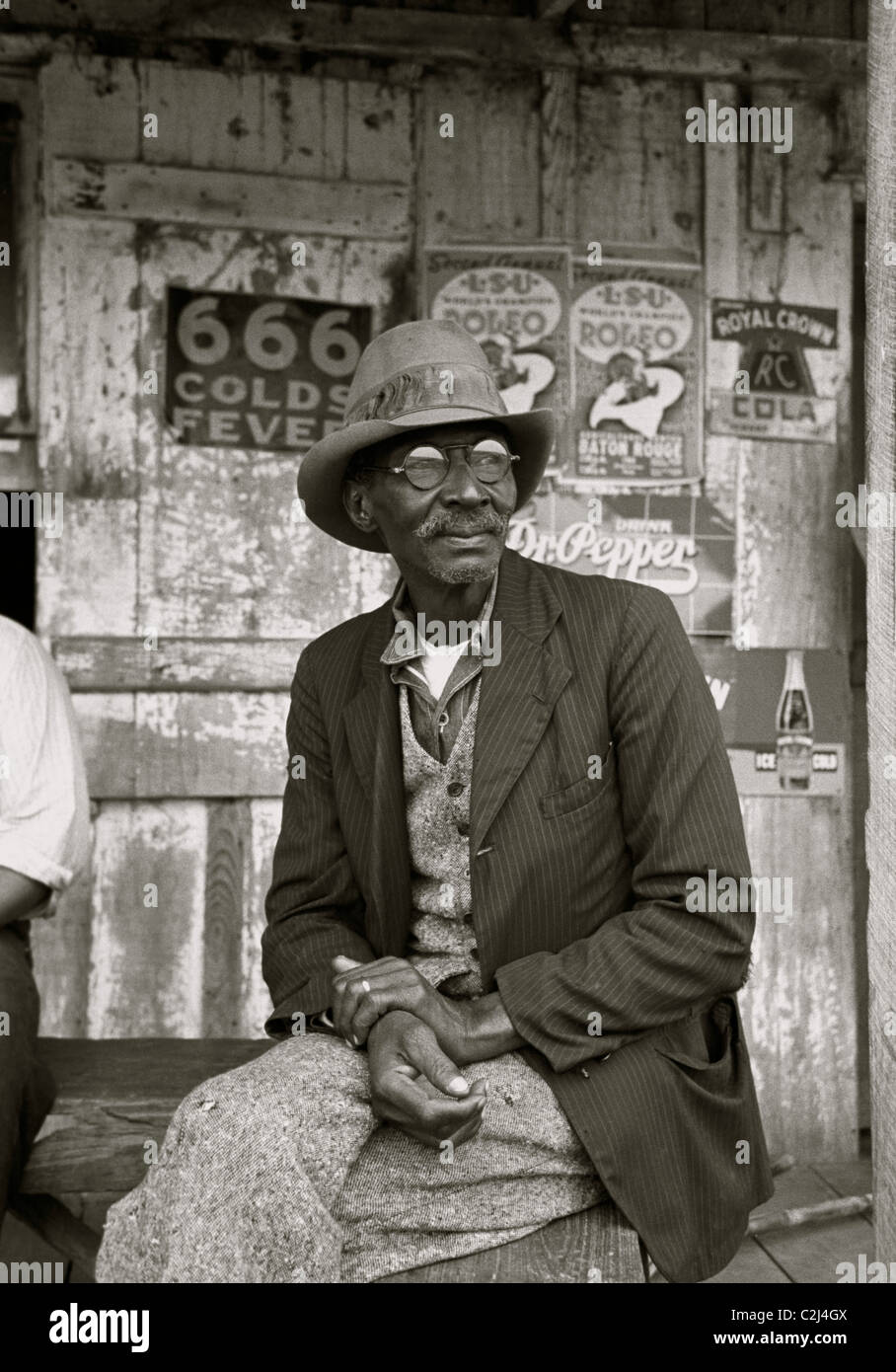 Negro on porch of general store near Jeanerette, Louisiana Stock Photo ...