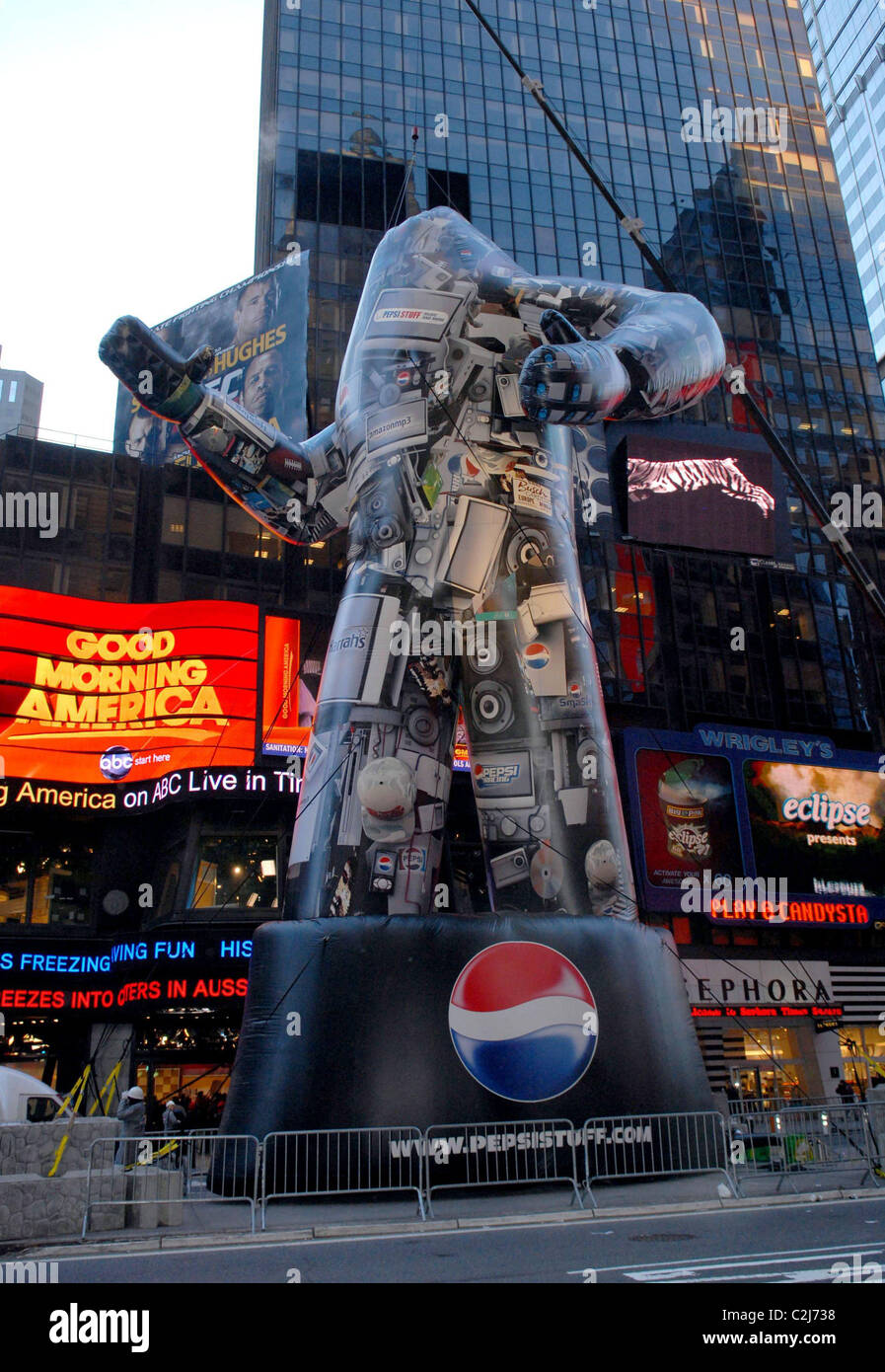 A giant inflatable figure towers over passersby in Times Square to ...