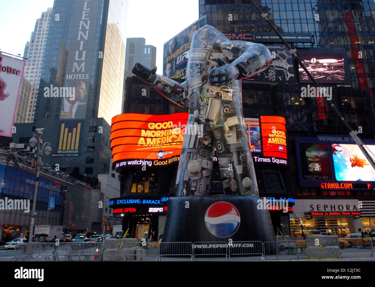 A giant inflatable figure towers over passersby in Times Square to ...