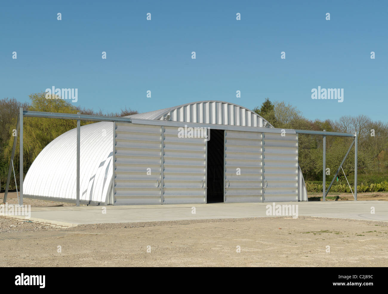 Modern aircraft hanger at a small airfield Stock Photo - Alamy