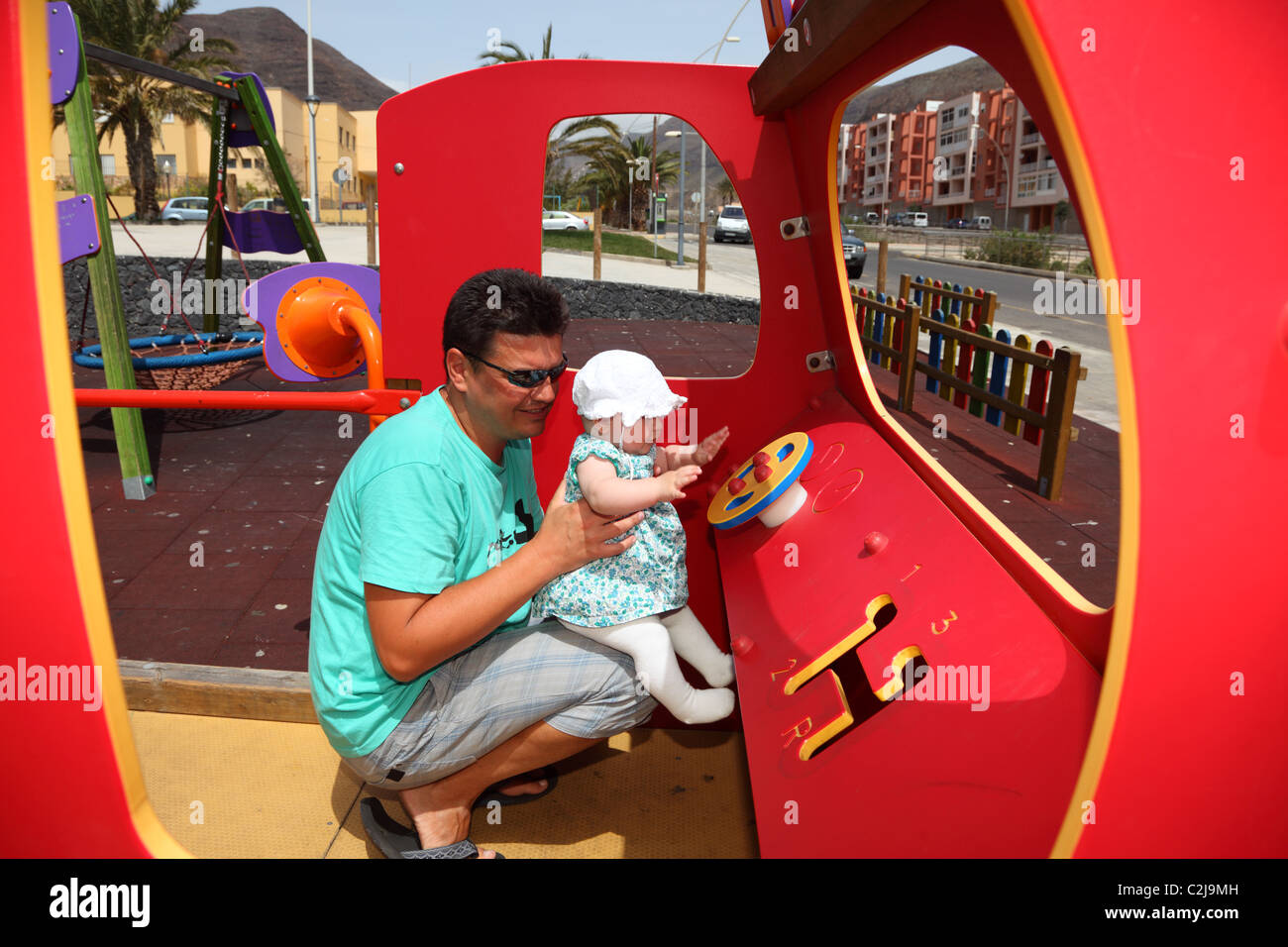 Father with little daughter on the playground Stock Photo - Alamy