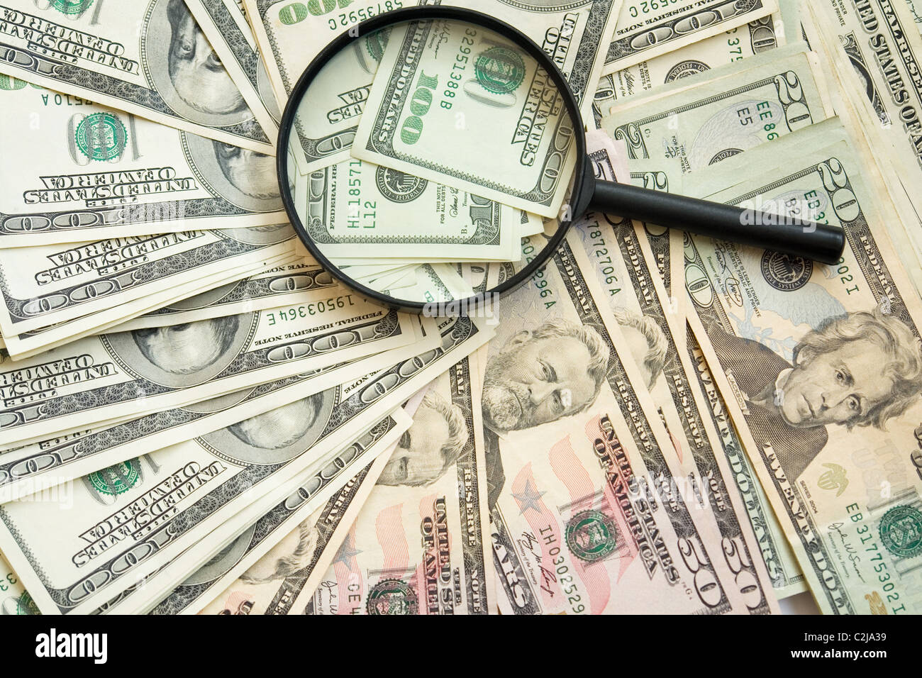 photography of the dollars with magnifying glass Stock Photo - Alamy