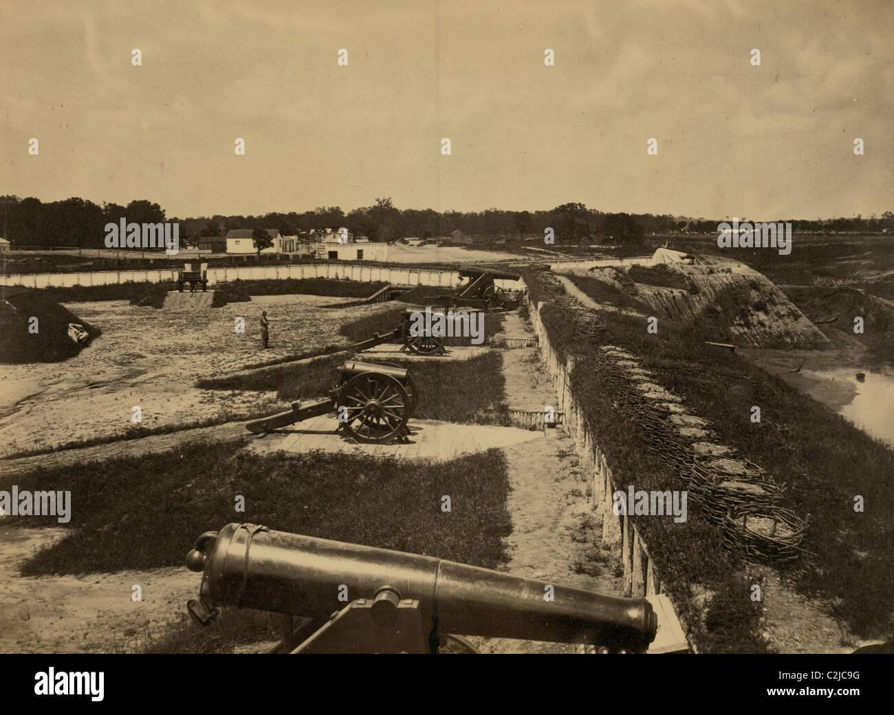 Mounted guns and ammunition around the perimeter of a fort Stock Photo ...