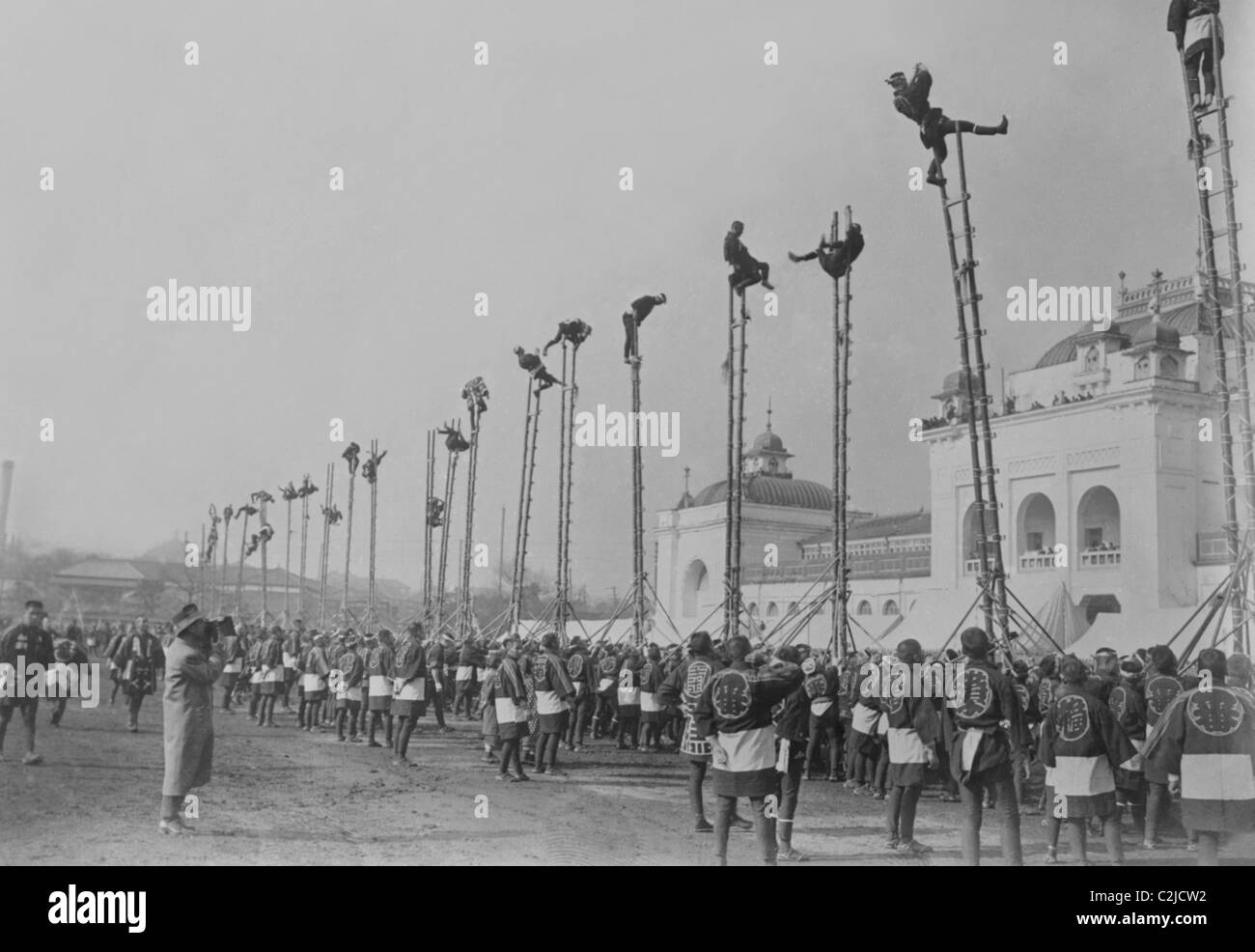 Two suited men weigh bars of gold on scales at the US Mint Stock Photo ...