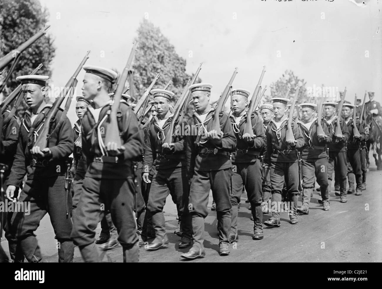 Chinese Sailors at Shoulder Arms march four abreast Stock Photo - Alamy