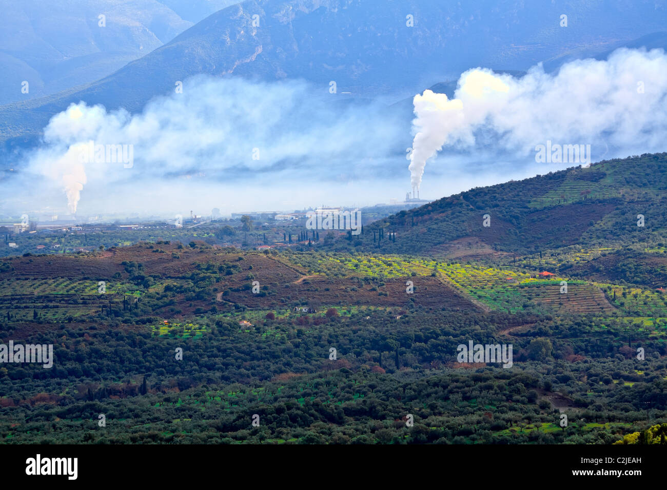 View of atmospheric air pollution from factory in countryside Stock ...