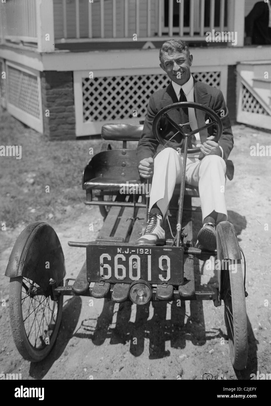 Driver sits in small Two Seater open Car Stock Photo - Alamy