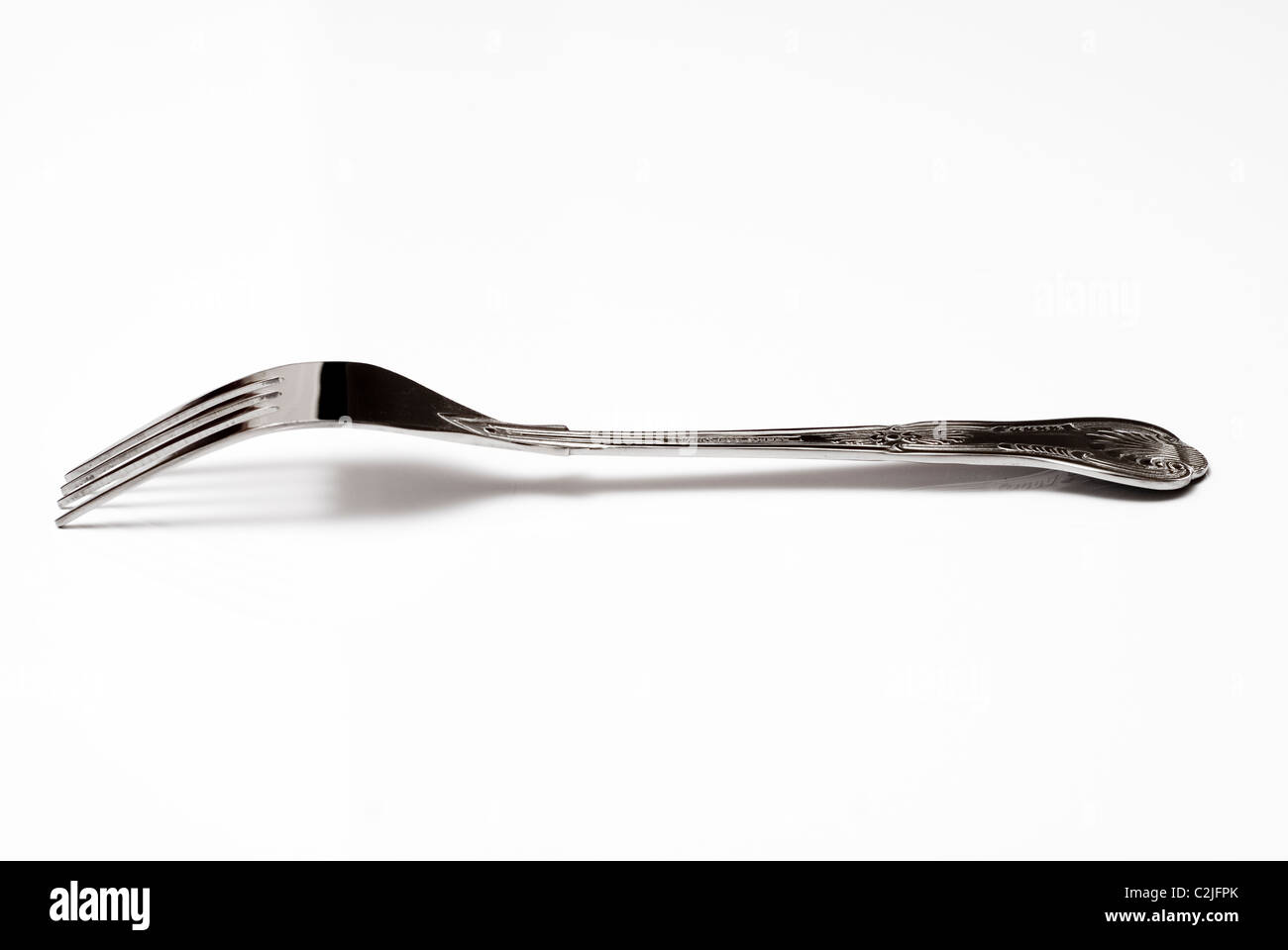 Eating fork isolated on a white background Stock Photo - Alamy