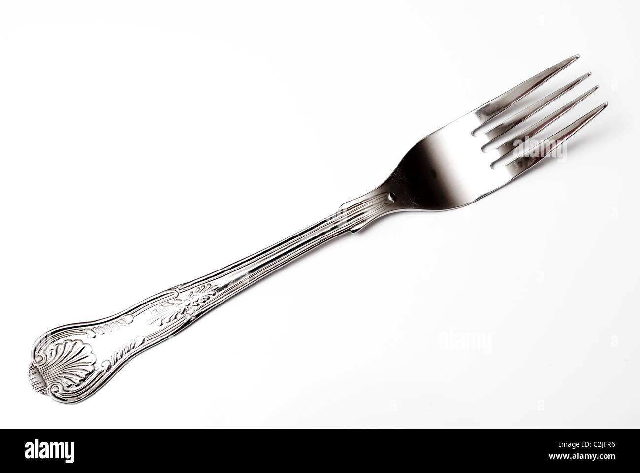Eating fork isolated on a white background Stock Photo - Alamy