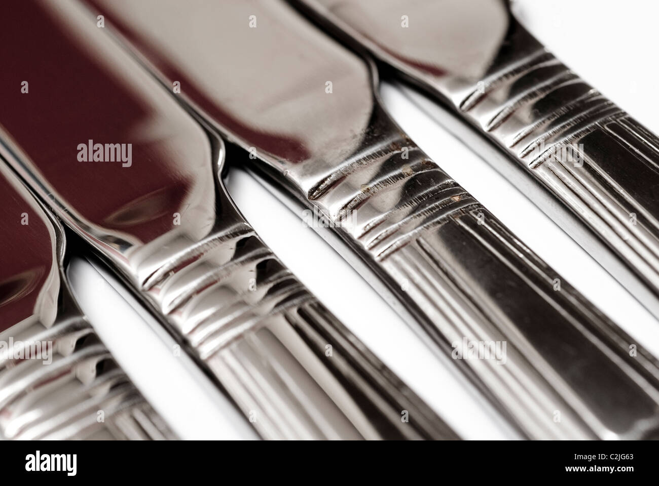 four eating knives isolated on a white background Stock Photo - Alamy