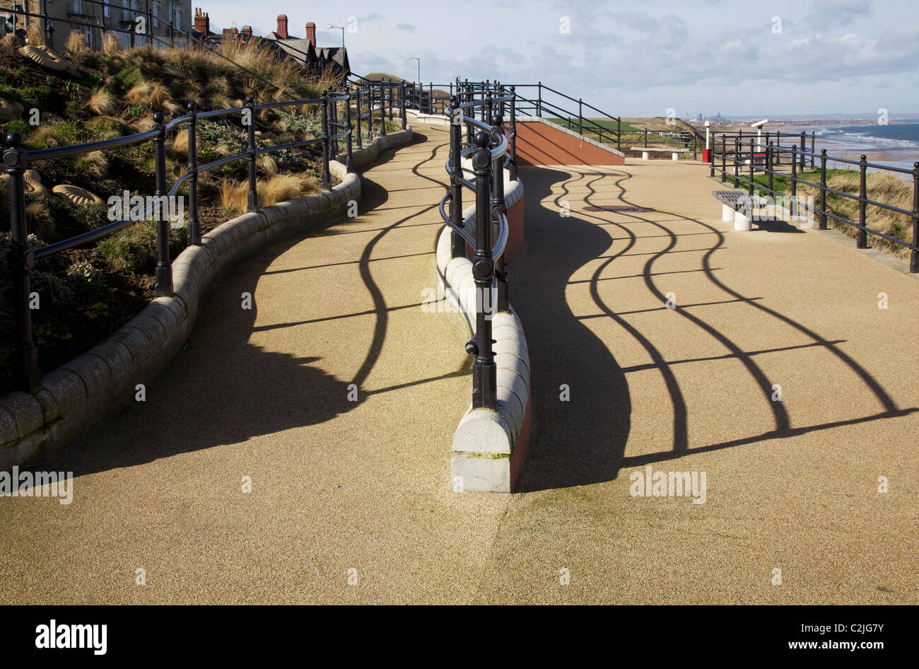 Strong shadows cast by metal fences Stock Photo - Alamy