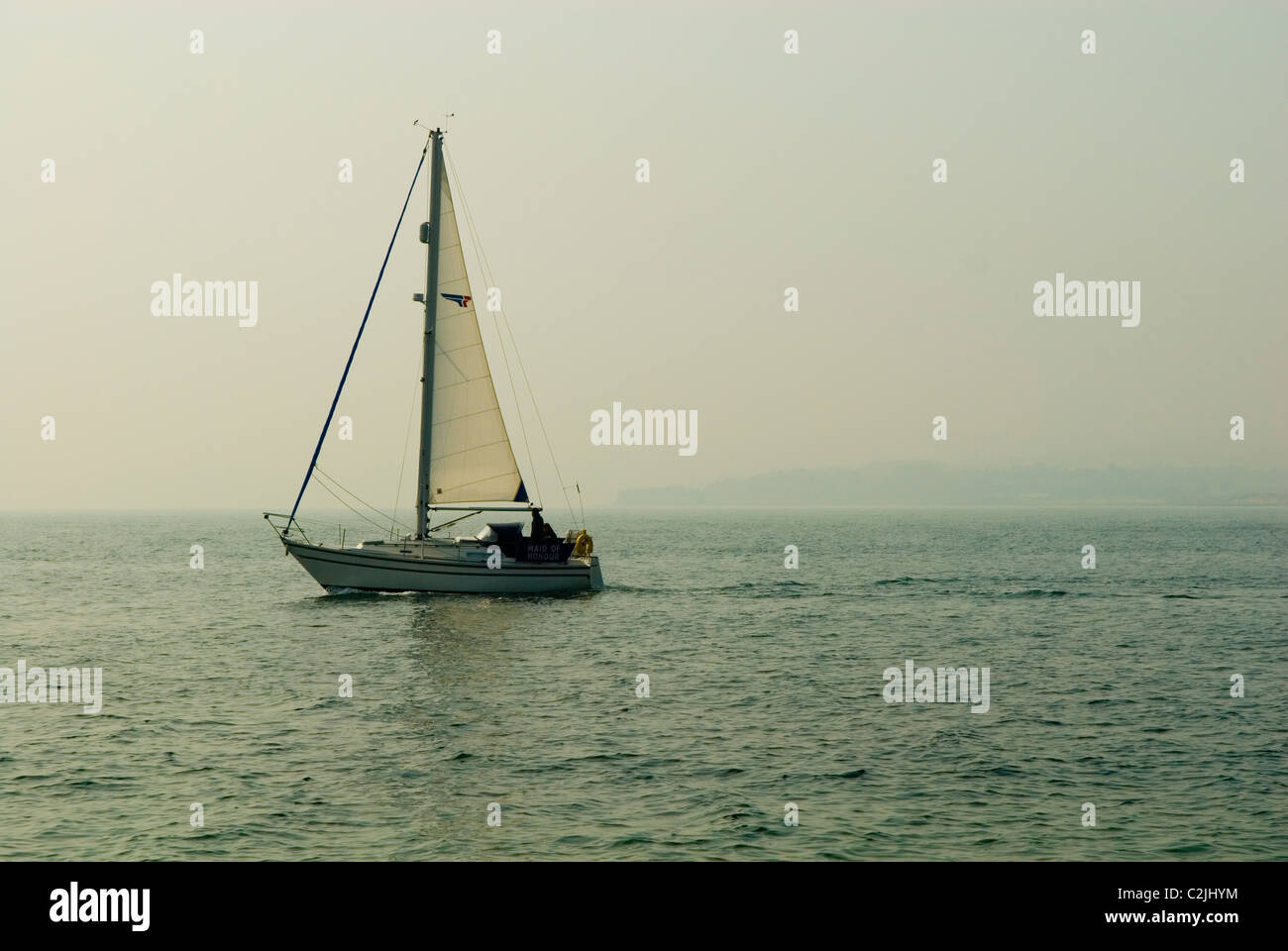Yacht sailing just off the Exmouth coast, Devon England UK Stock Photo ...
