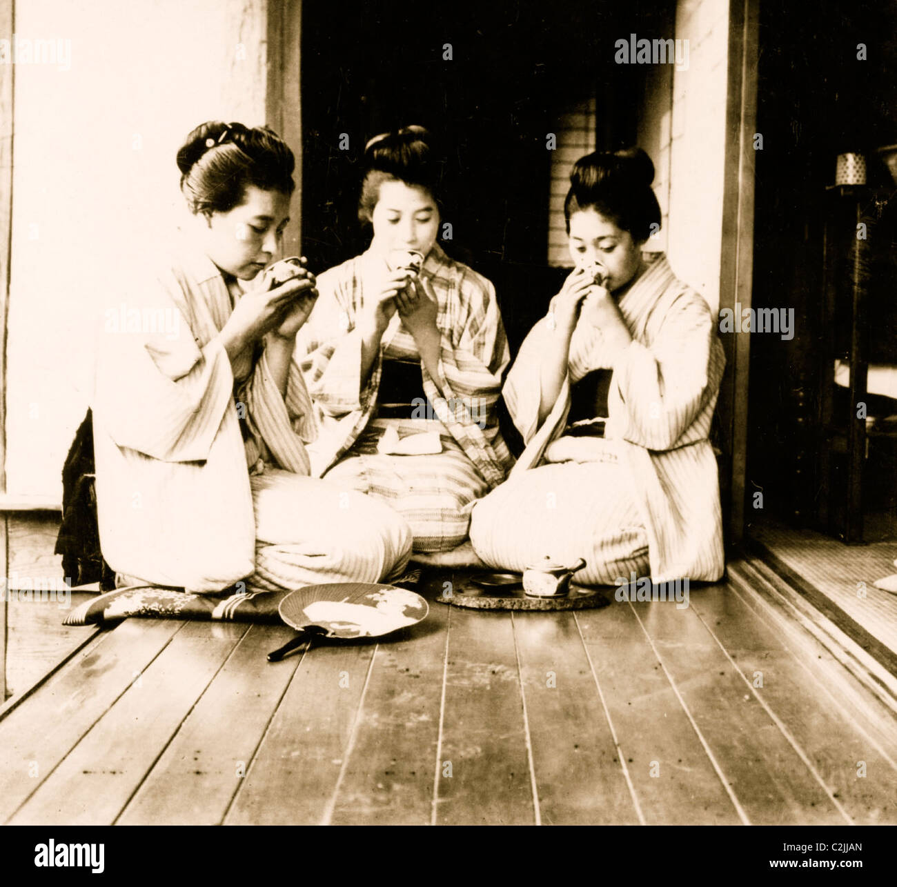 Japanese women seated on floor sipping tea Stock Photo - Alamy