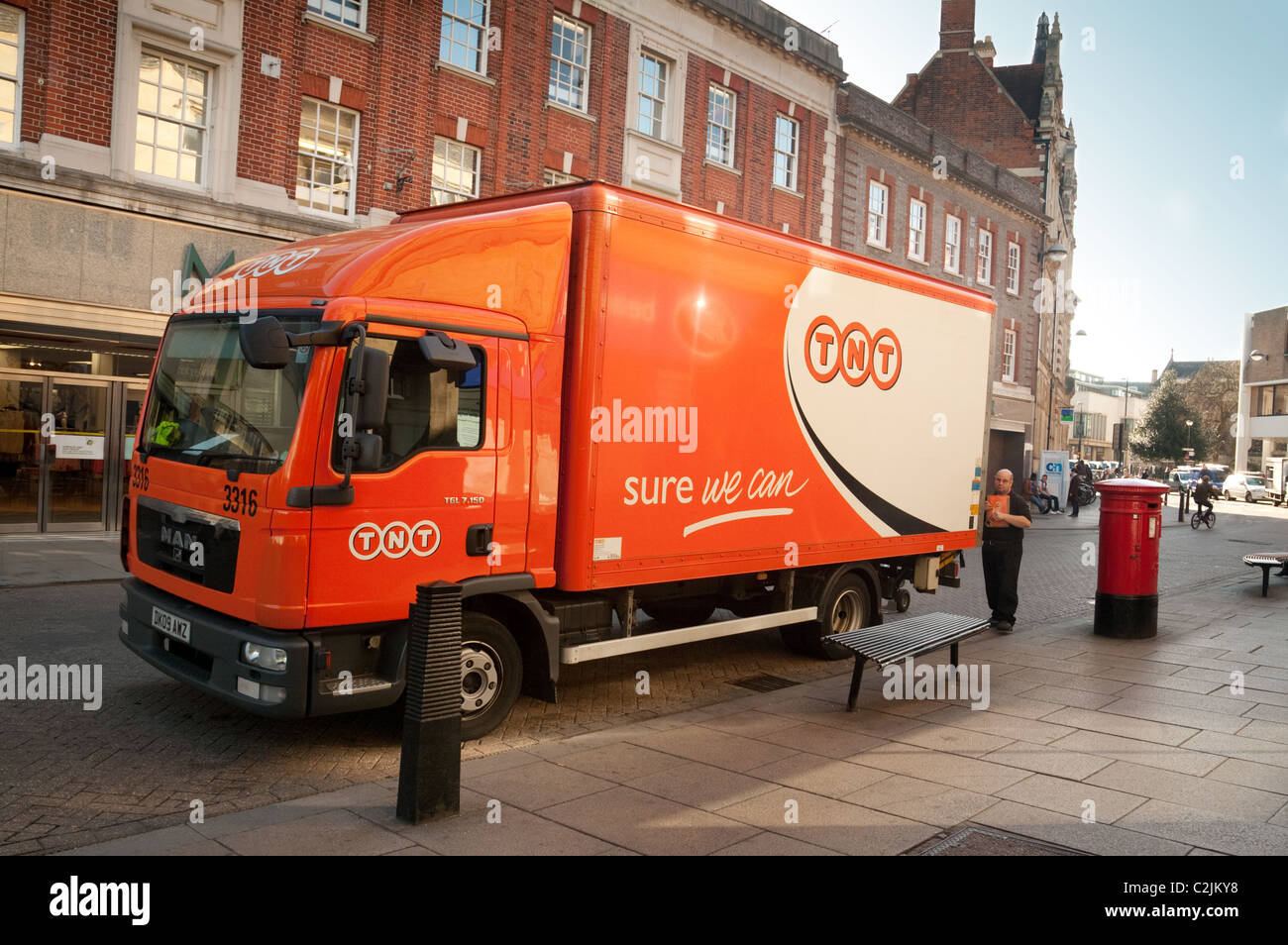 A TNT postman and his delivery truck at a postbox, Sidney Street ...