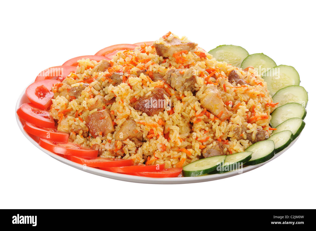 Rice with meat on a plate isolated on white background Stock Photo - Alamy