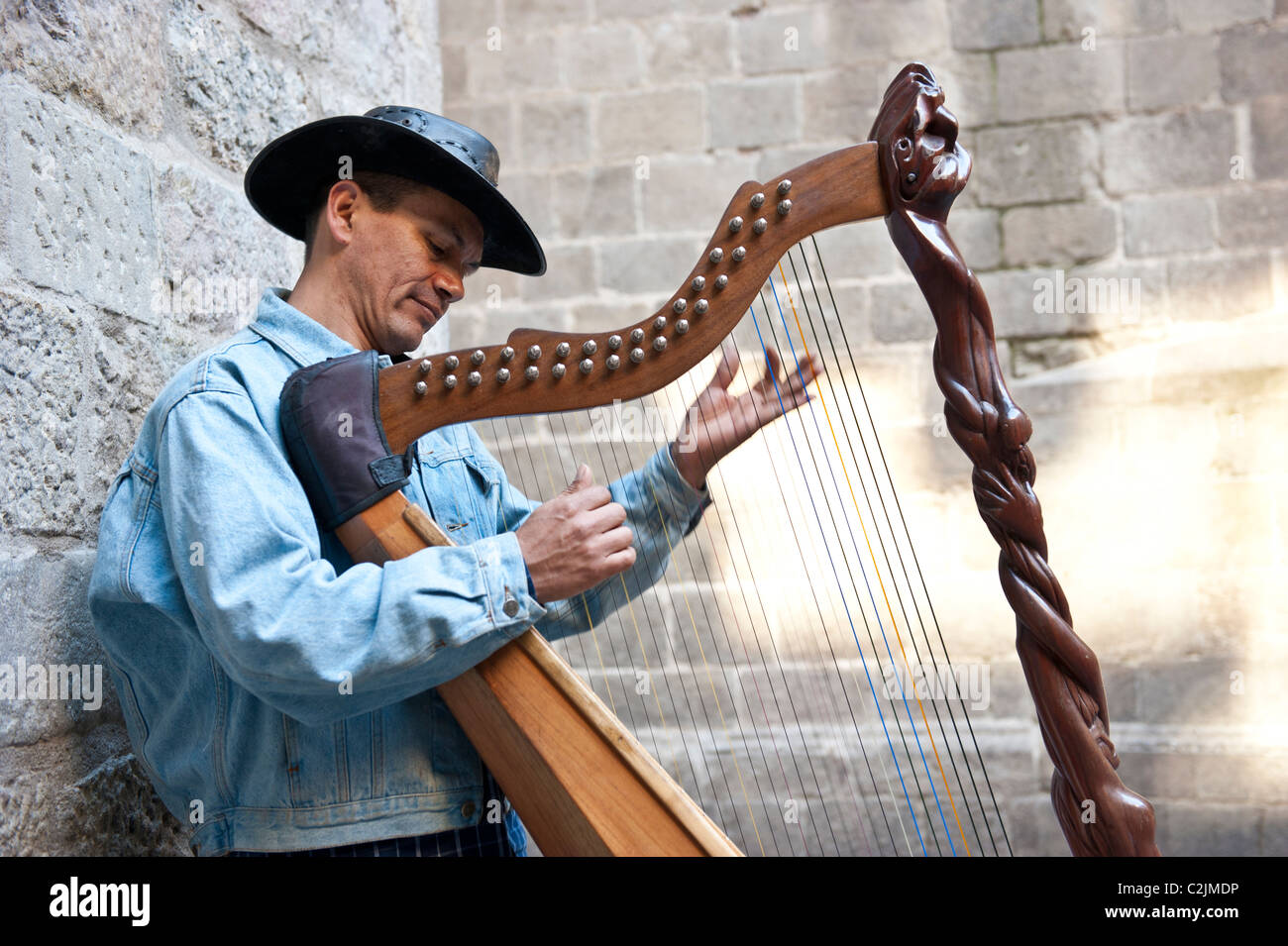 Harp Player performing in the streets of the Gothic area of Barcelona ...