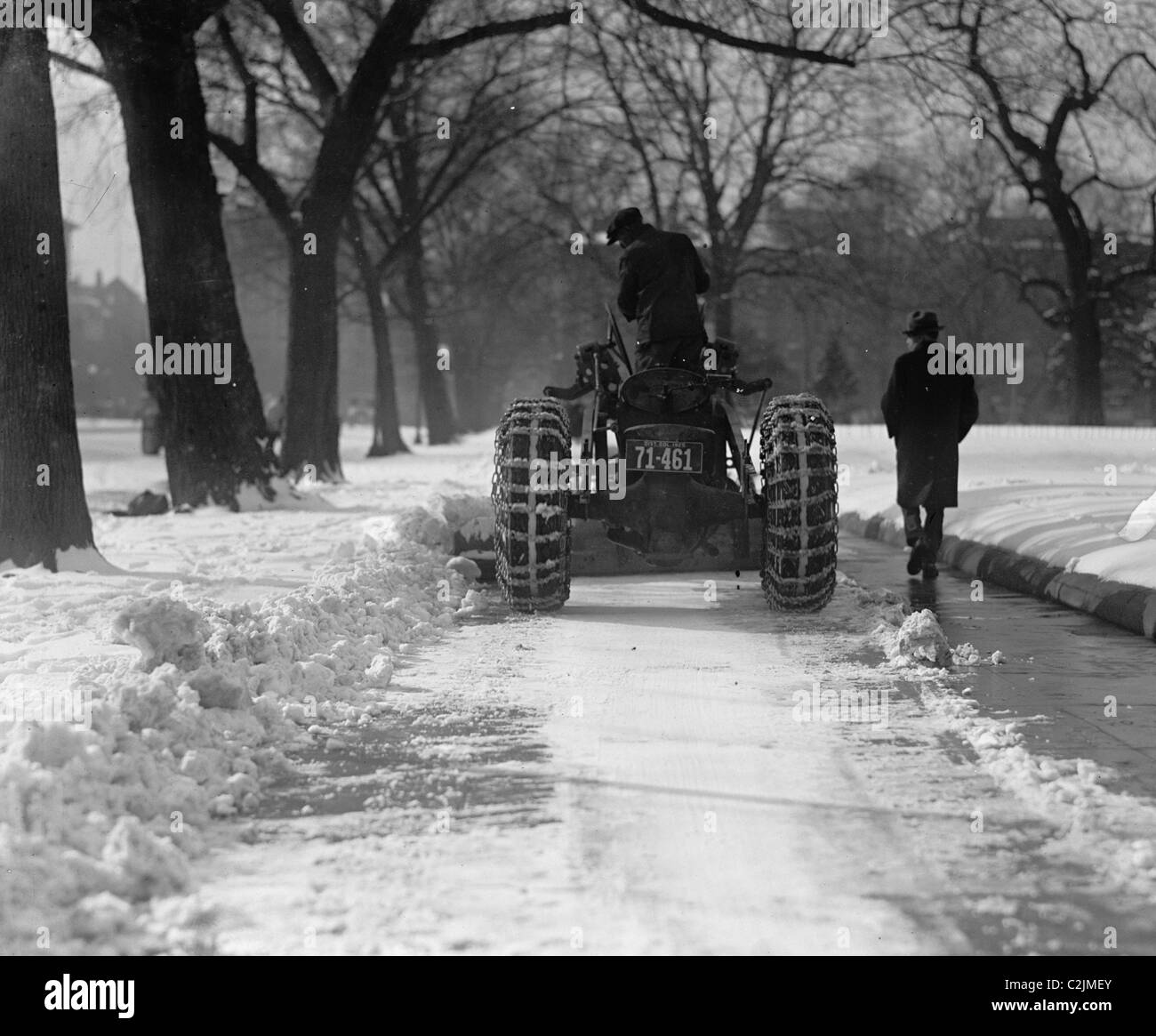 A Ford Tractor cleans snow on DC Street Stock Photo - Alamy