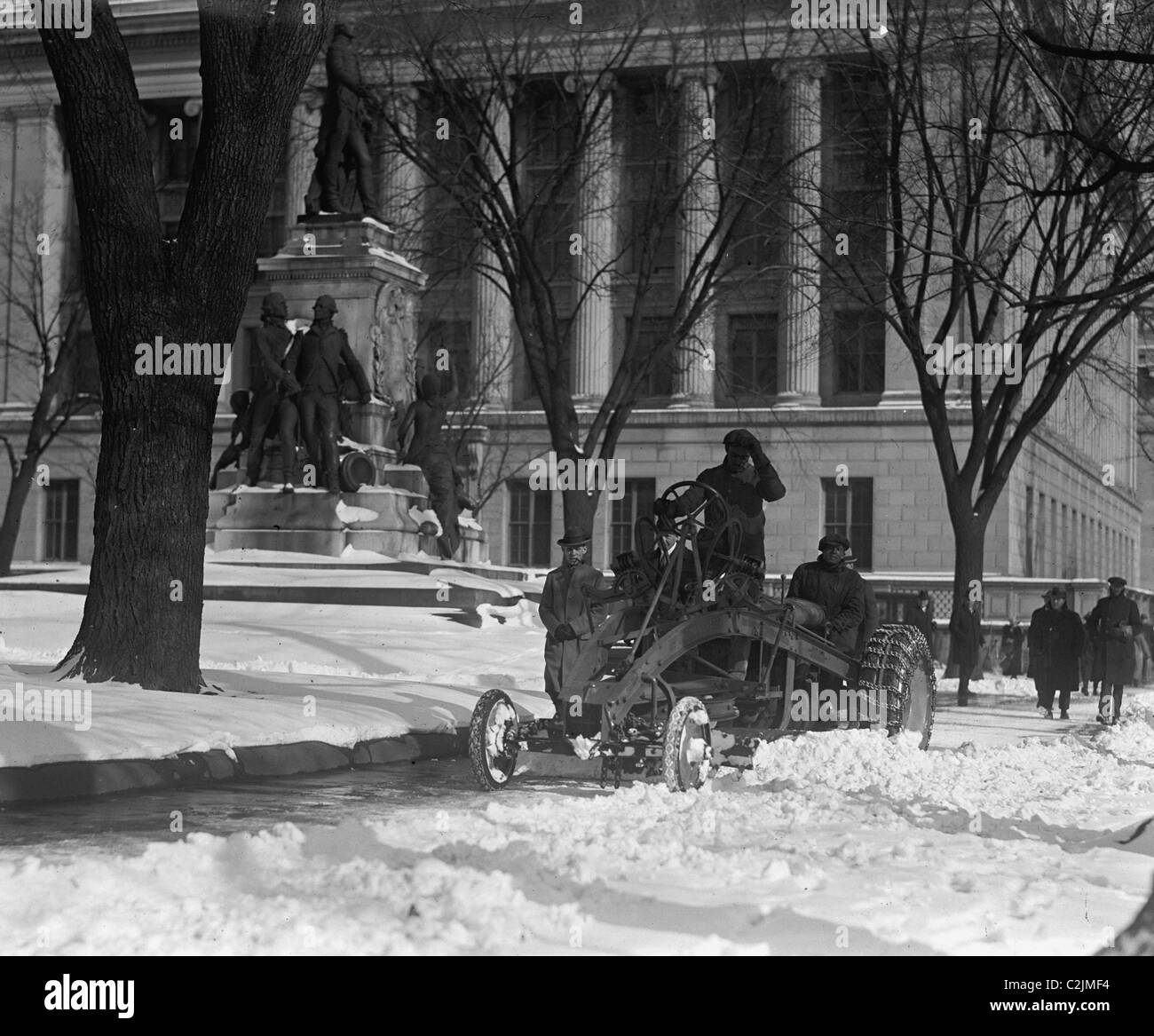 A Ford Tractor cleans snow on DC Street Stock Photo - Alamy