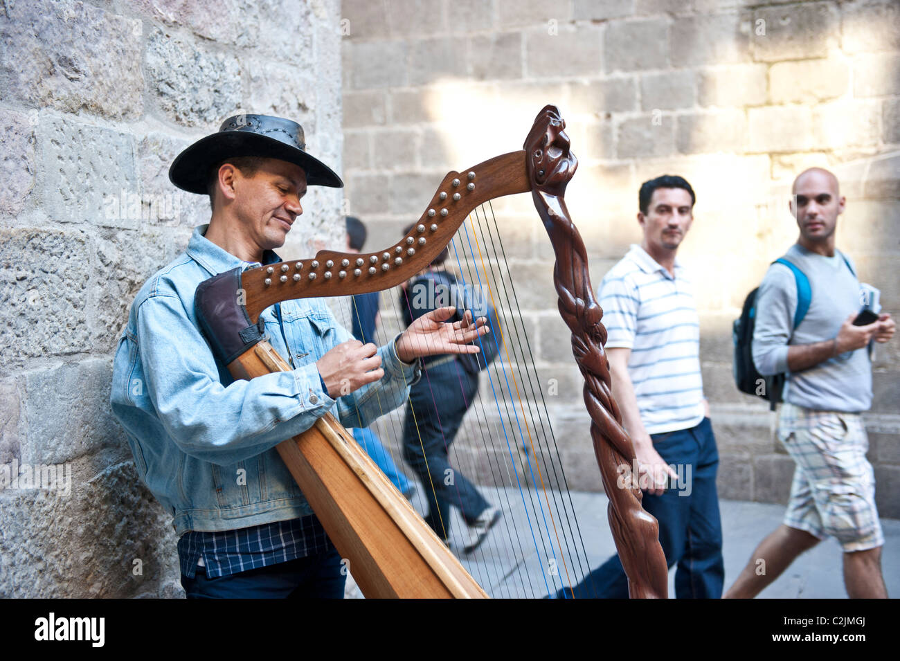 Harp Player performing in the streets of the Gothic area of Barcelona ...