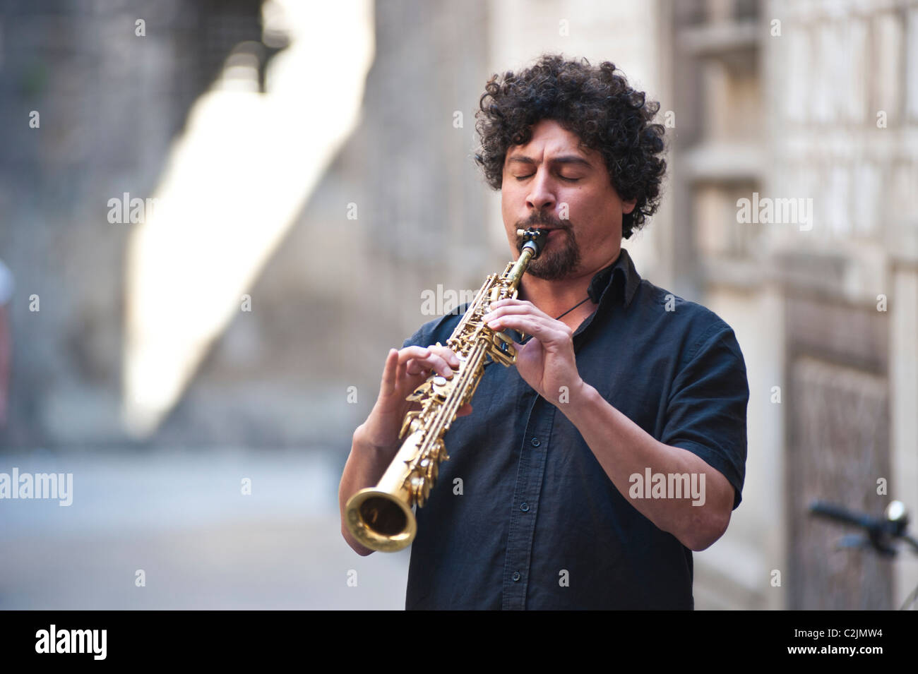 Street musician performing in the Gothic part of Barcelona, Spain Stock ...