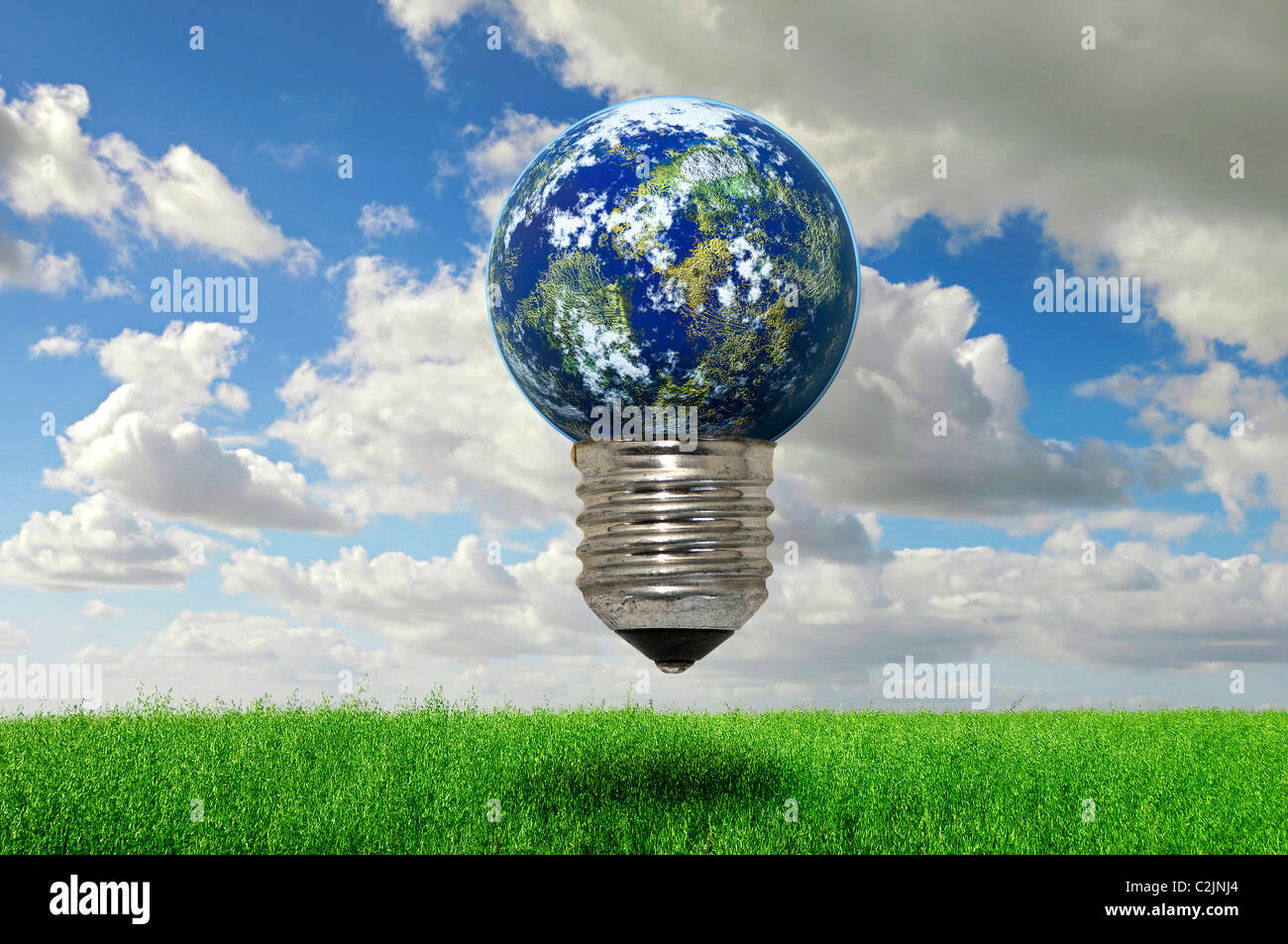 Beautiful image of a grass field with blue cloudy sky and a light bulb ...