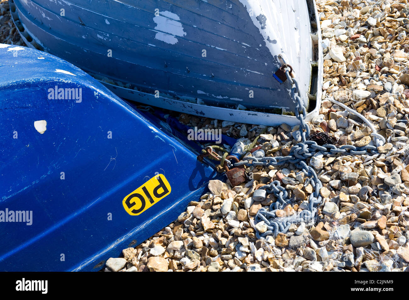 Close up of two rowing boats landed upside down on the beach Stock ...