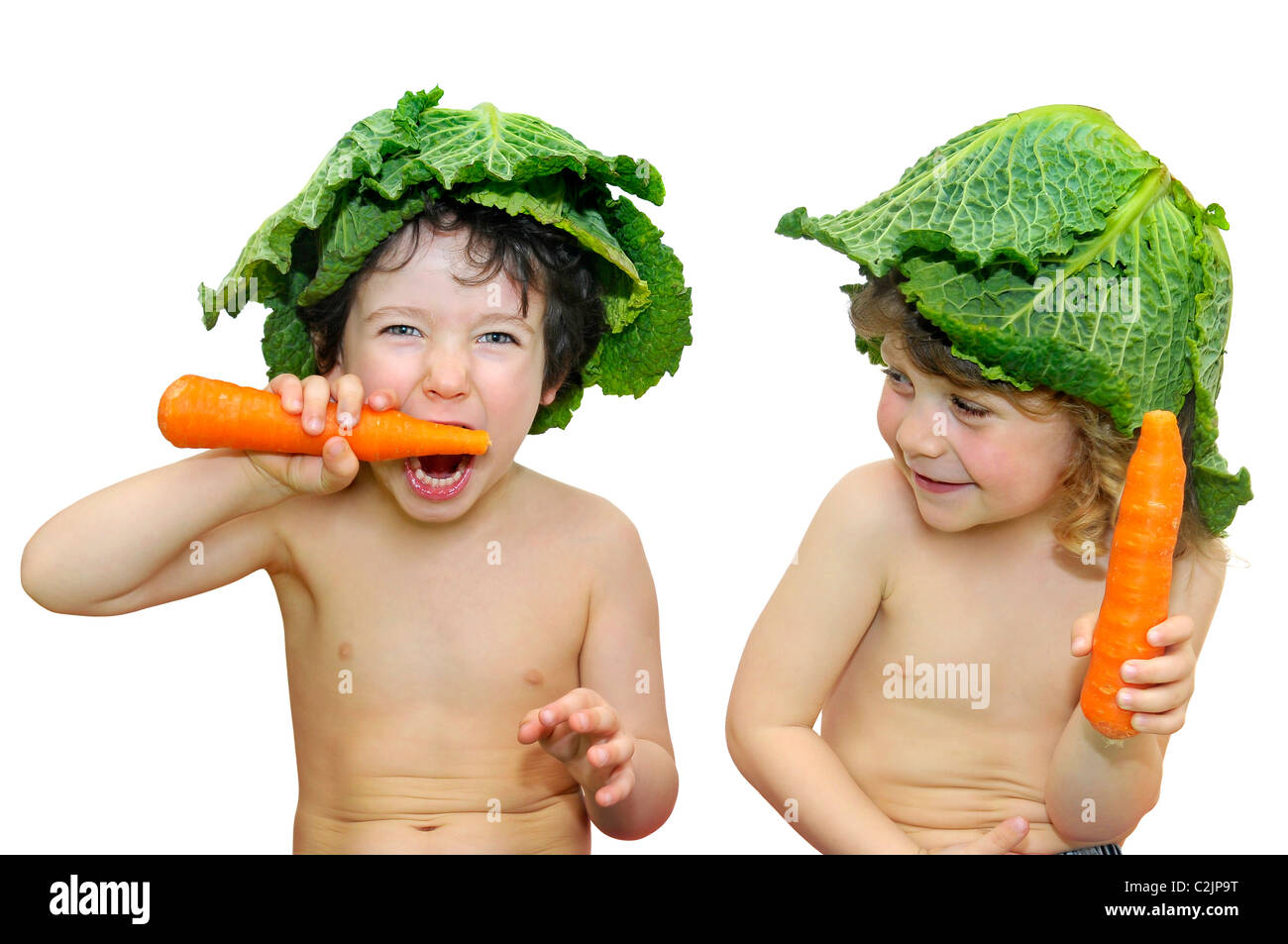Beautiful children with cabbage hats eating carrots Stock Photo - Alamy