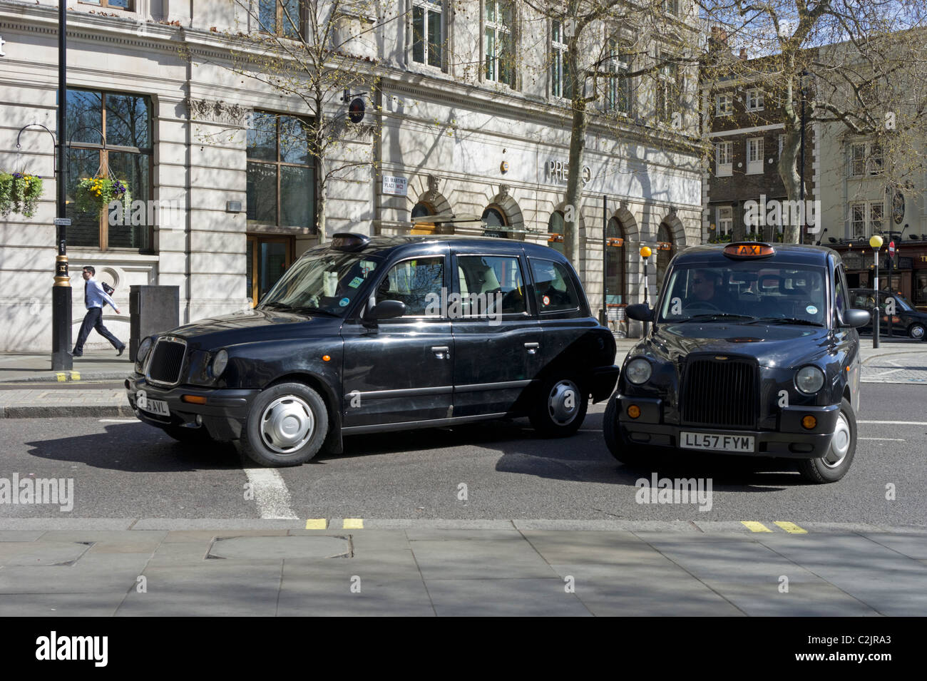Two London taxis, London, England, UK Stock Photo - Alamy