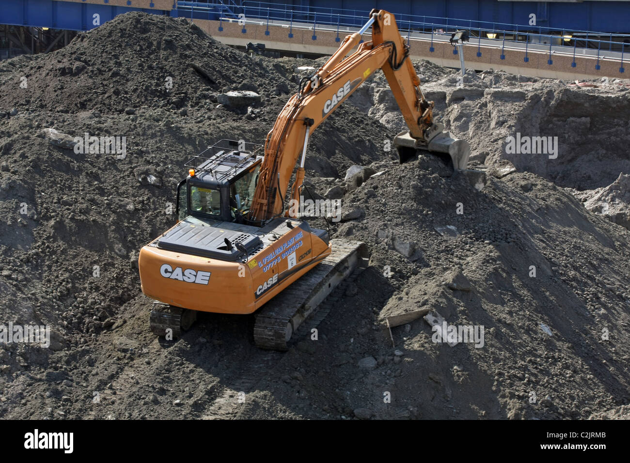 A Case excavator working in the foundations of the new Cross Rail ...