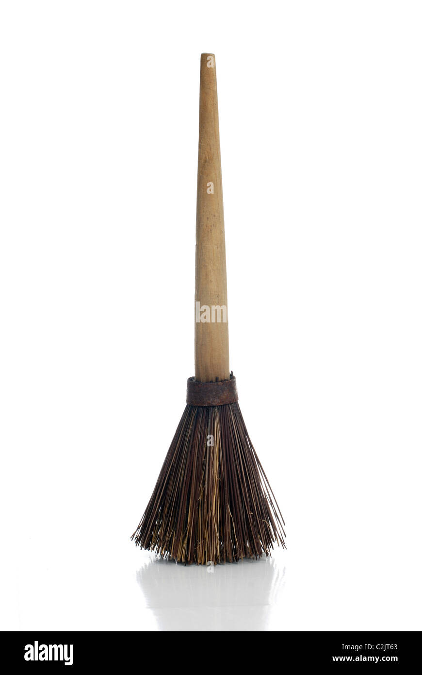Broom on white background with shadow reflection Stock Photo - Alamy