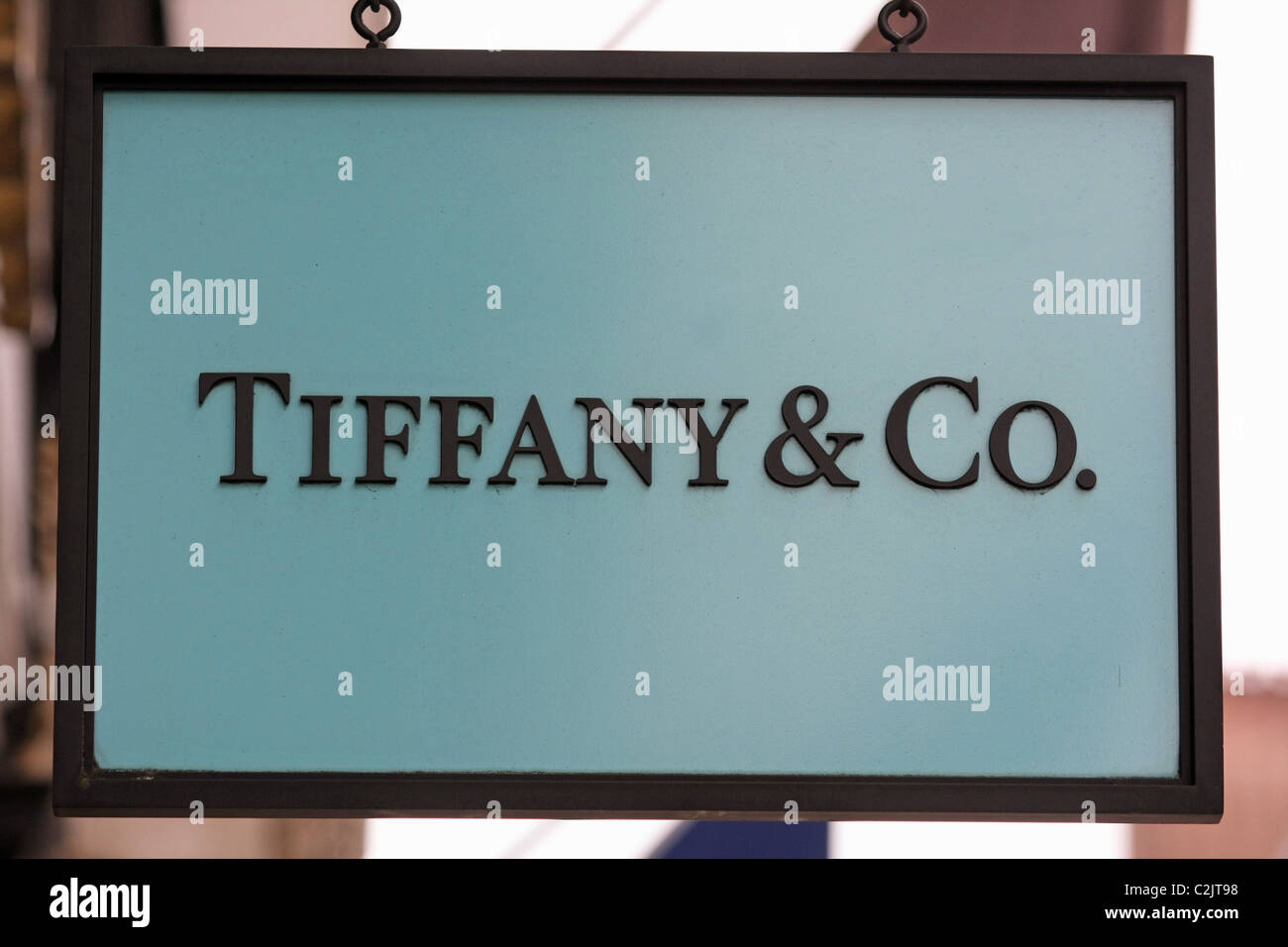 A hanging Tiffany & Co sign outside one of its London stores Stock ...