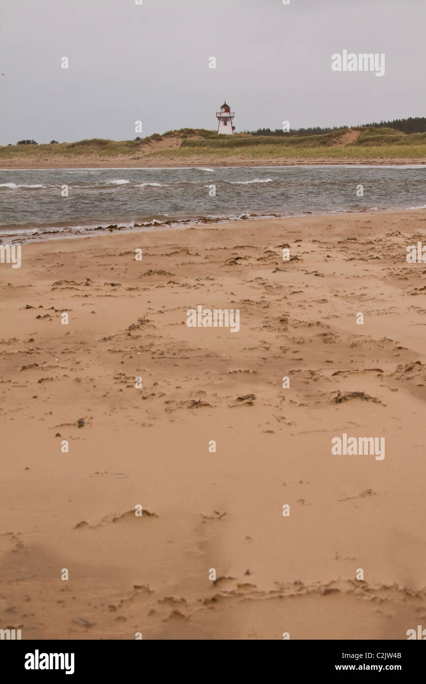 Red sand beach with Lighthouse in background, Prince Edward Island ...
