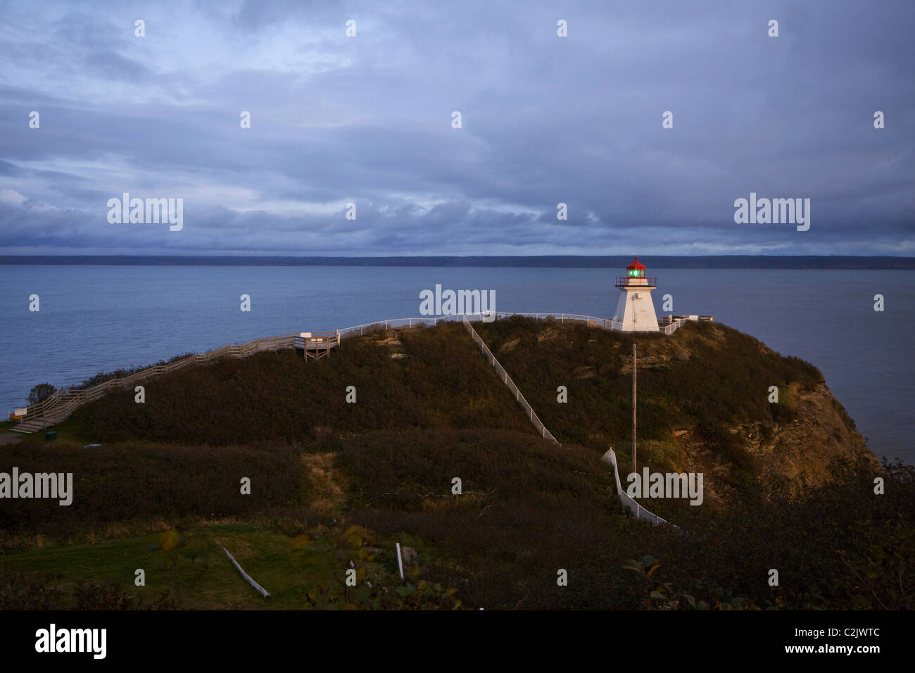 Cape Enrage LIghthouse with dramatic dusk sky, Bay of Fundy, New ...