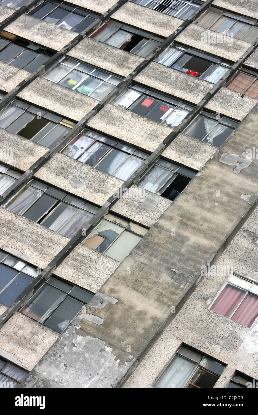 Facade of a rundown building in a poor neighborhood in the center of ...