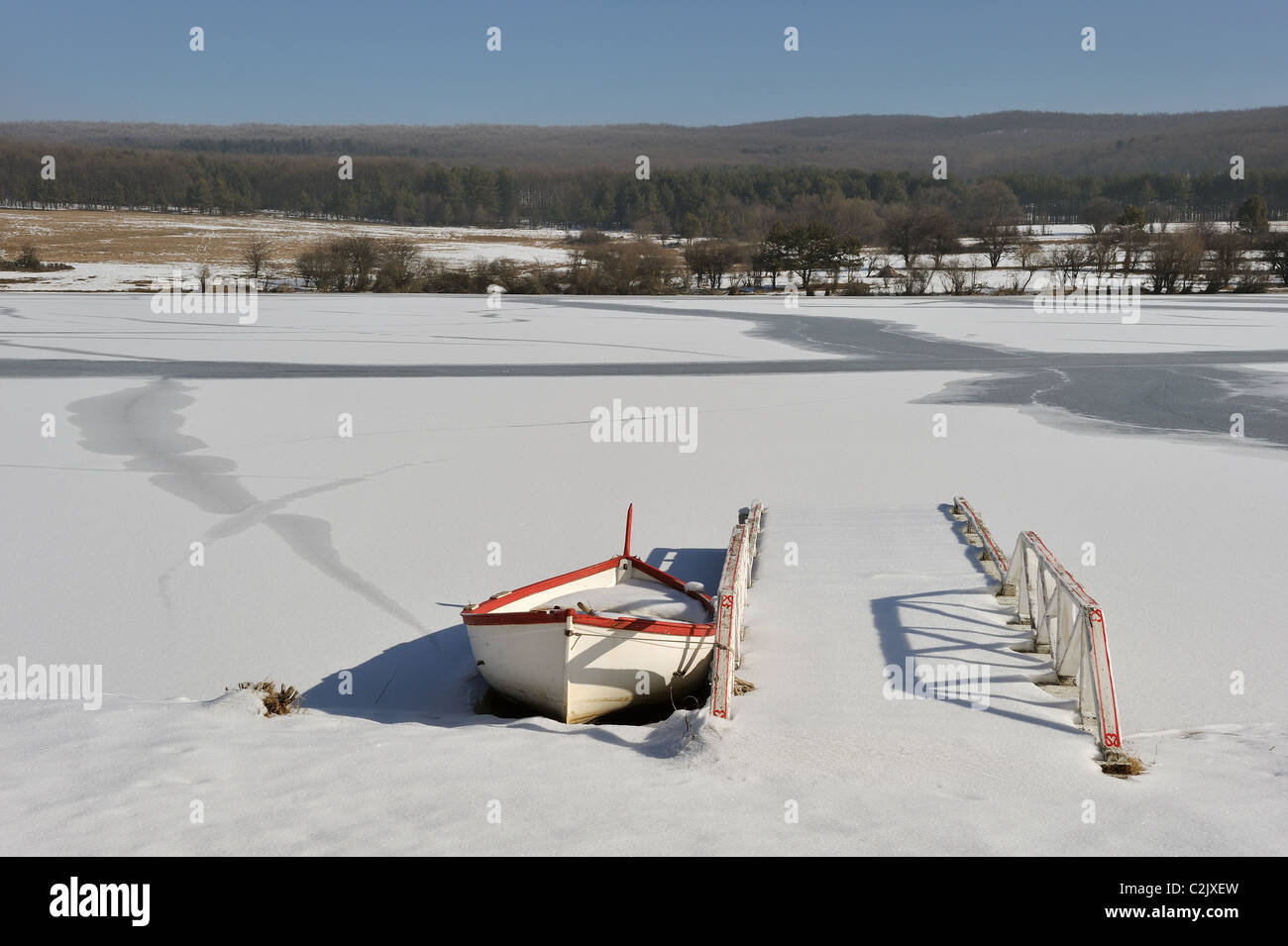 Bridge and boat in winter Stock Photo - Alamy